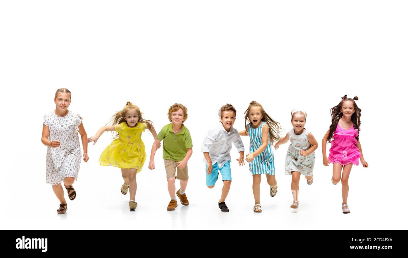 Happy children, little and emotional caucasian kids jumping and running ...