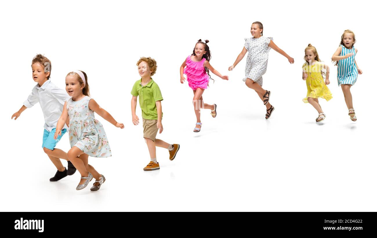 Happy children, little and emotional caucasian kids jumping and running ...