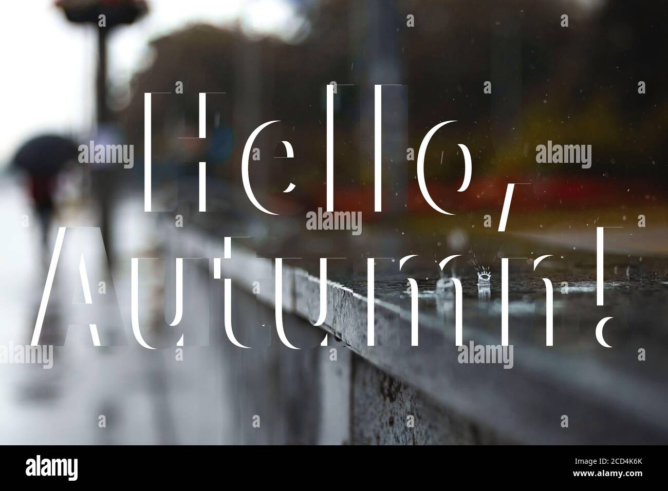 Urban landscape in the rain. Drops on the parapet along the sidewalk ...