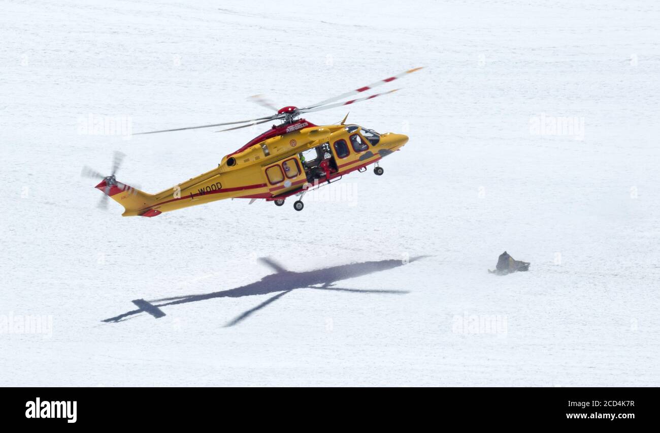Yellow rescue helicopter near the Swiss Matterhorn Stock Photo - Alamy