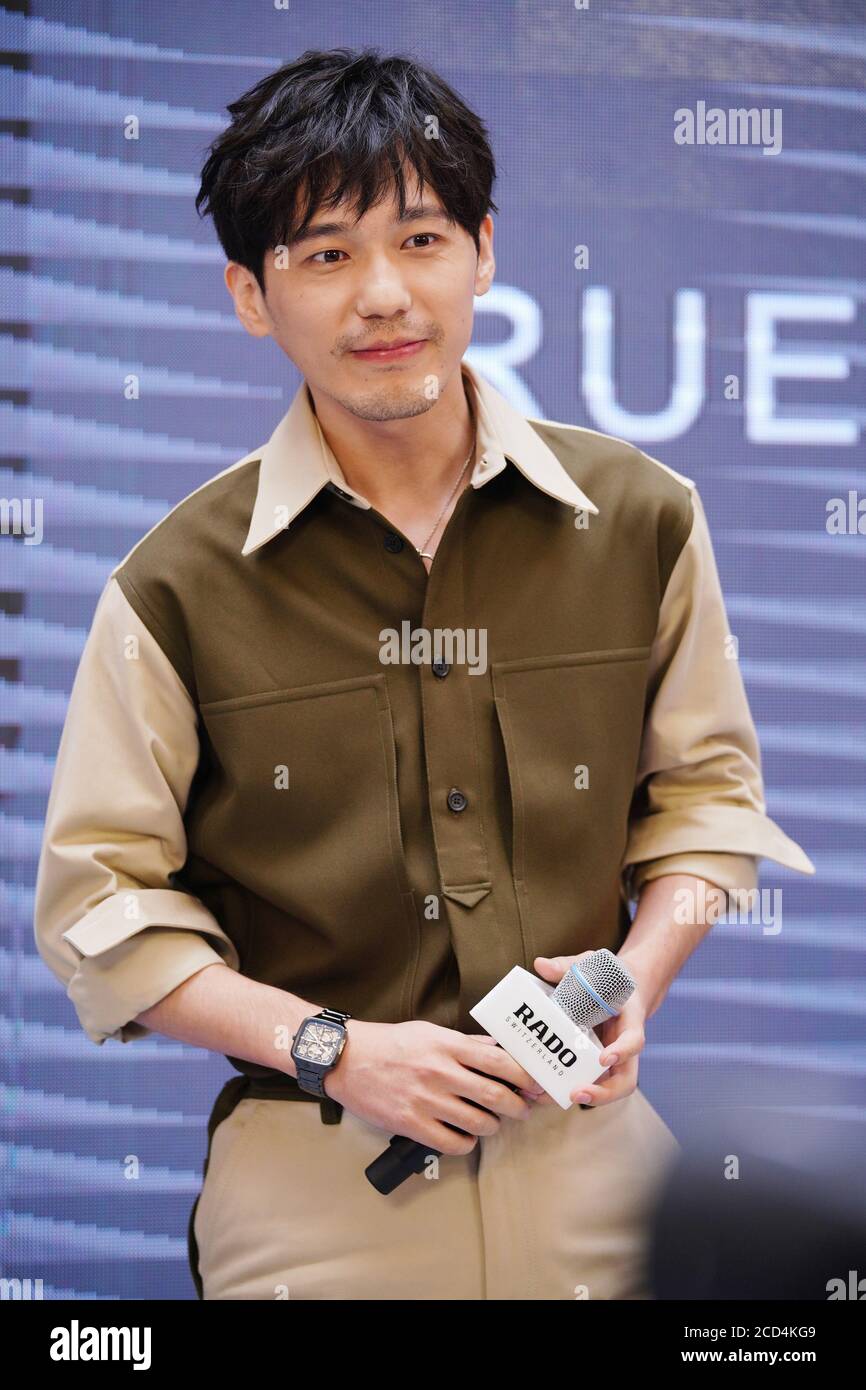 Chinese actor Bai Yu shows off elegance with a shirt on during a ...