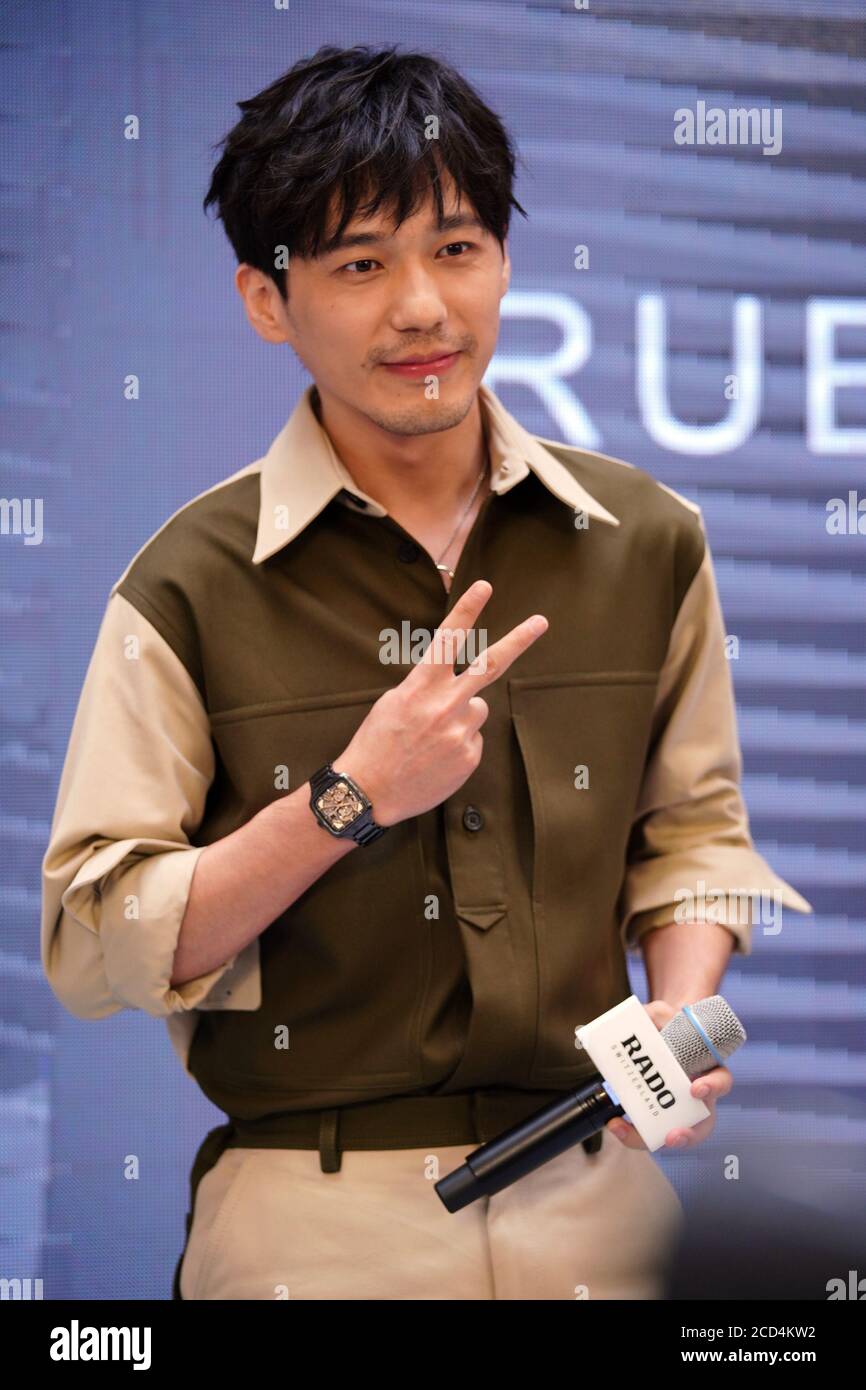 Chinese actor Bai Yu shows off elegance with a shirt on during a ...