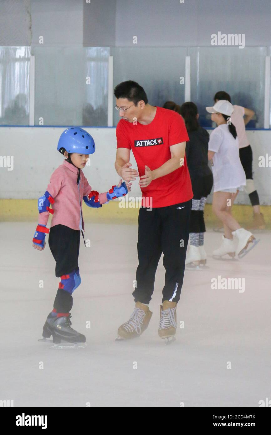 Citizens enjoy skating at an indoor ice rink to relieve scorching ...