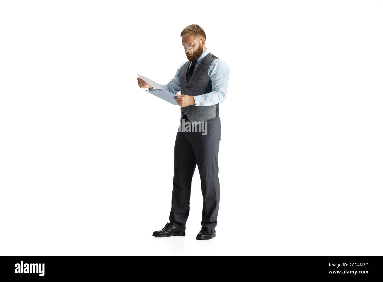 Cheerful handsome businessman isolated over white studio background ...