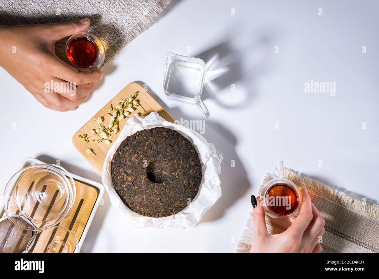 Chinese Puer tea ceremony on a white background, a man and a woman ...
