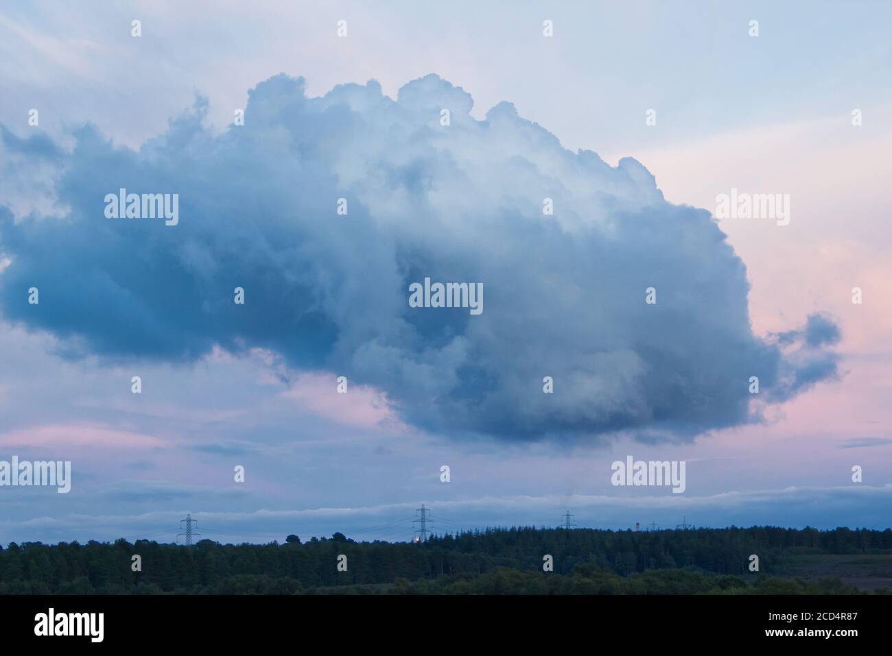 big cunulusforecast cloud over New Forest landscape Stock Photo - Alamy
