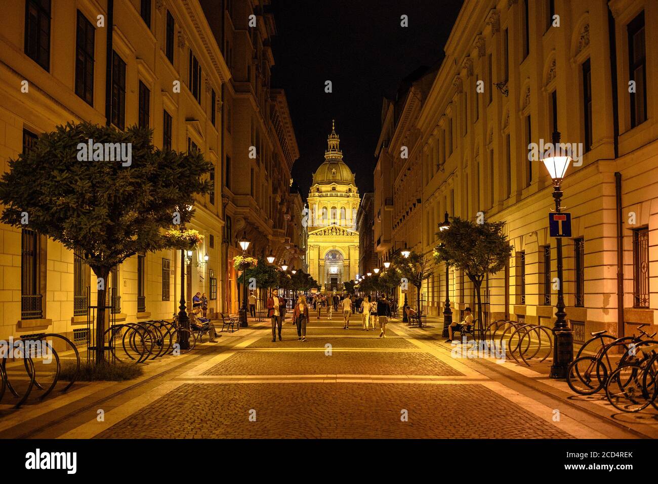 People walking on Zrinyi utca with Saint Stephen's Basilica in the ...