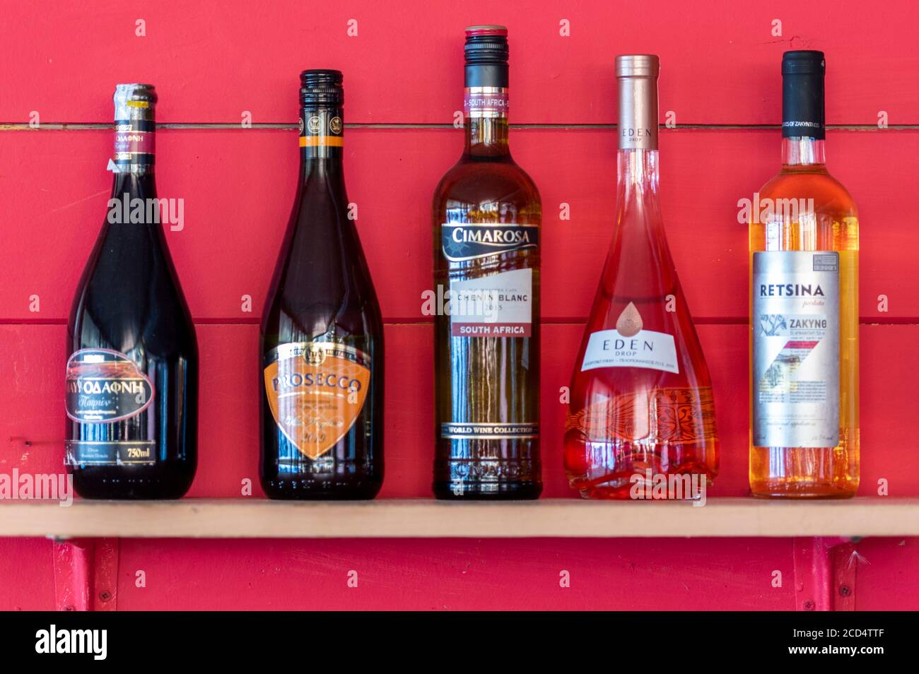 bottles of wine and spirits on a shelf at a greek taverna on zakynthos ...