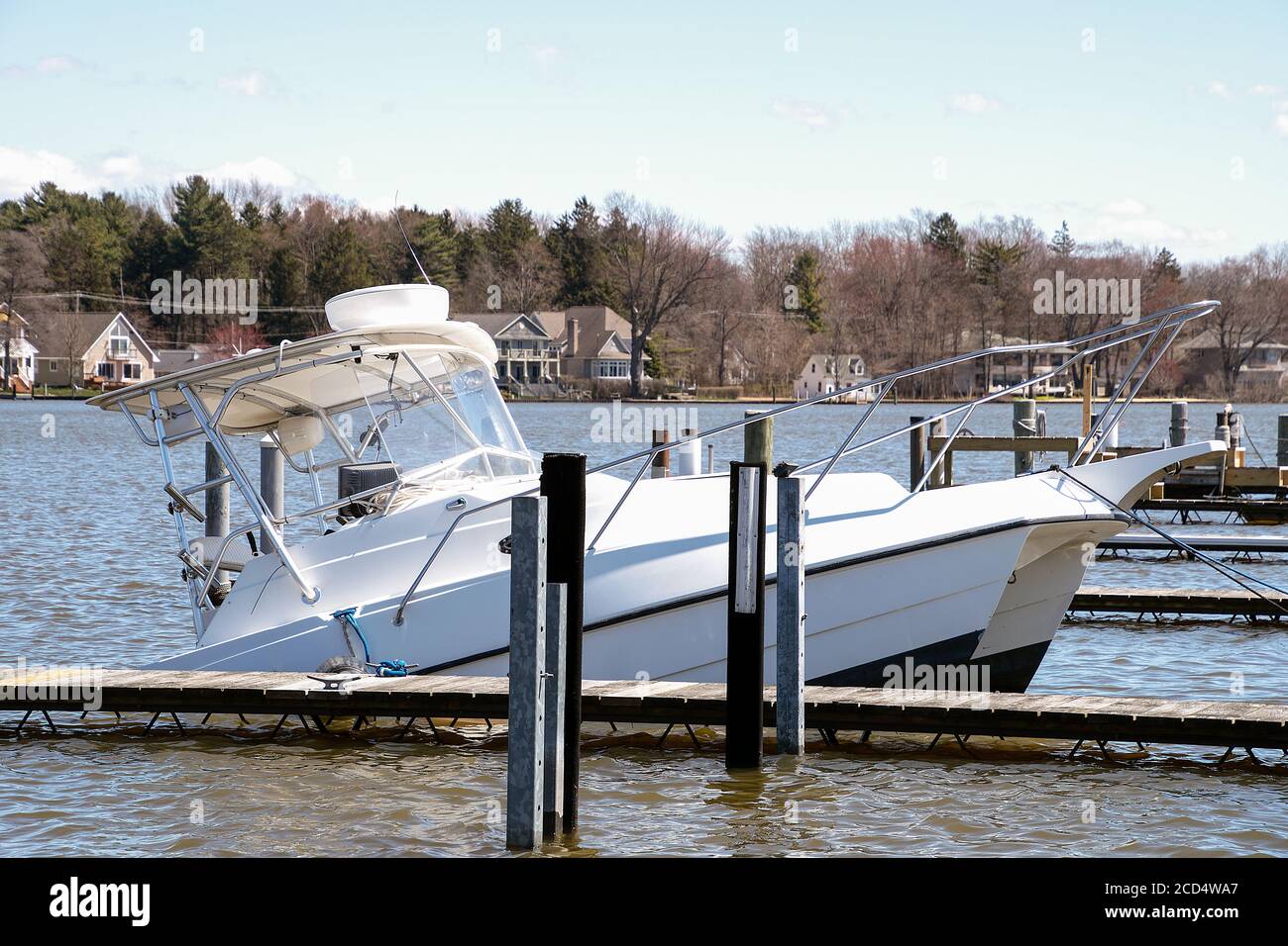sinking white catamaran boat in marina boat slip Stock Photo - Alamy