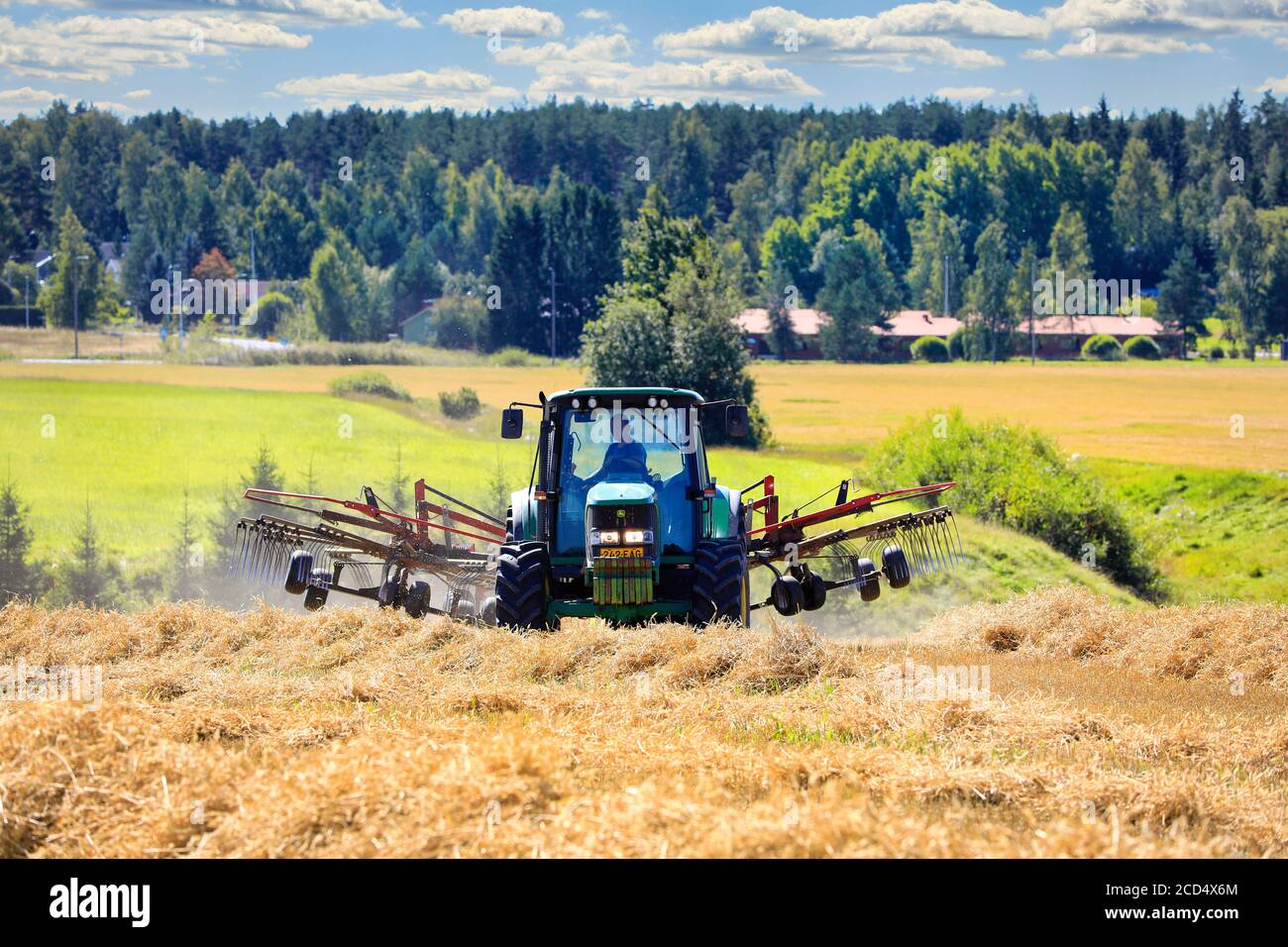 Farmer raking grass hi-res stock photography and images - Alamy