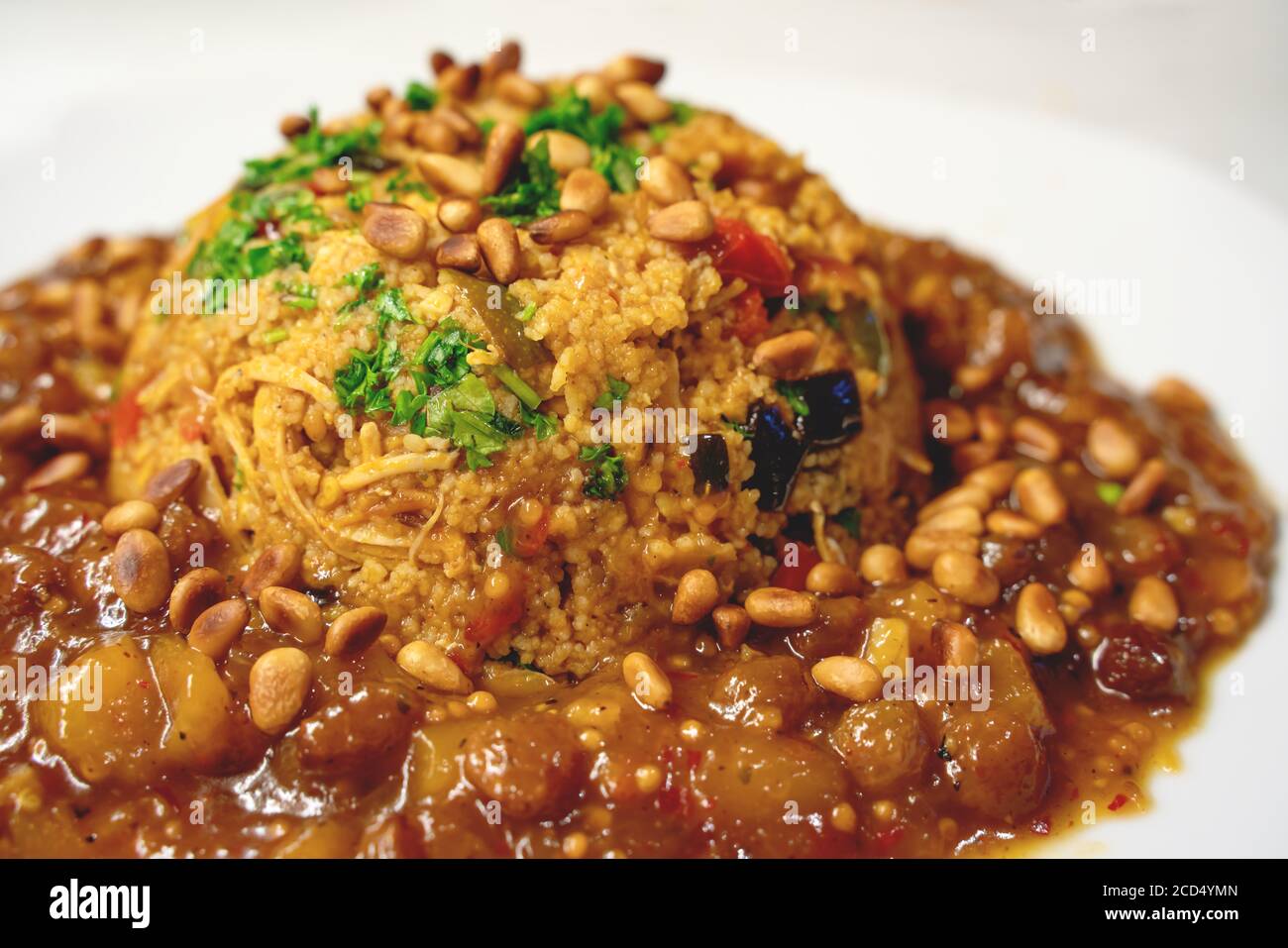 Typical Arabic dish with couscous, vegetables and peach mango raisin ...