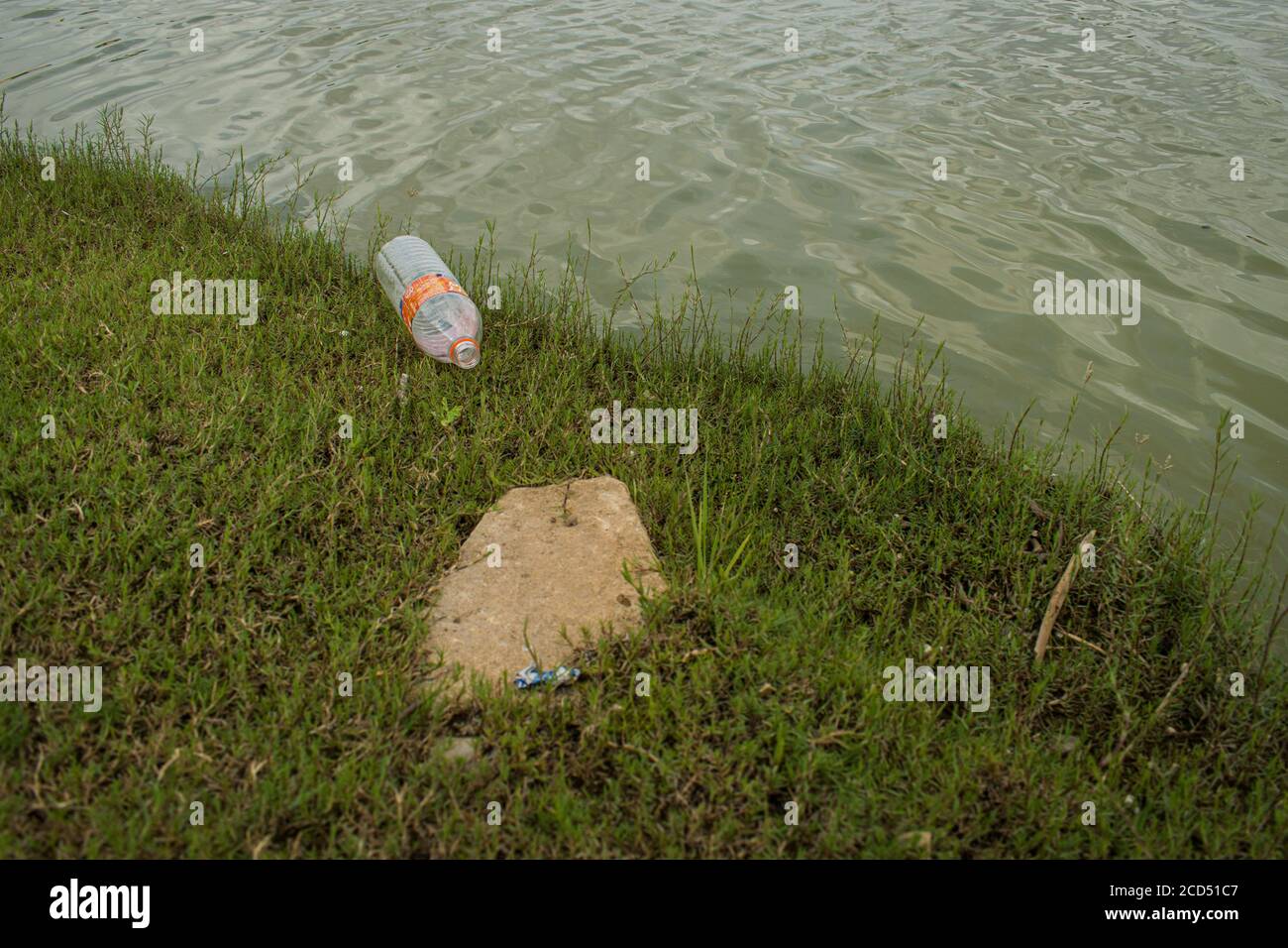 polluted lake plastic bottles and garbage at the lake. plastic ...