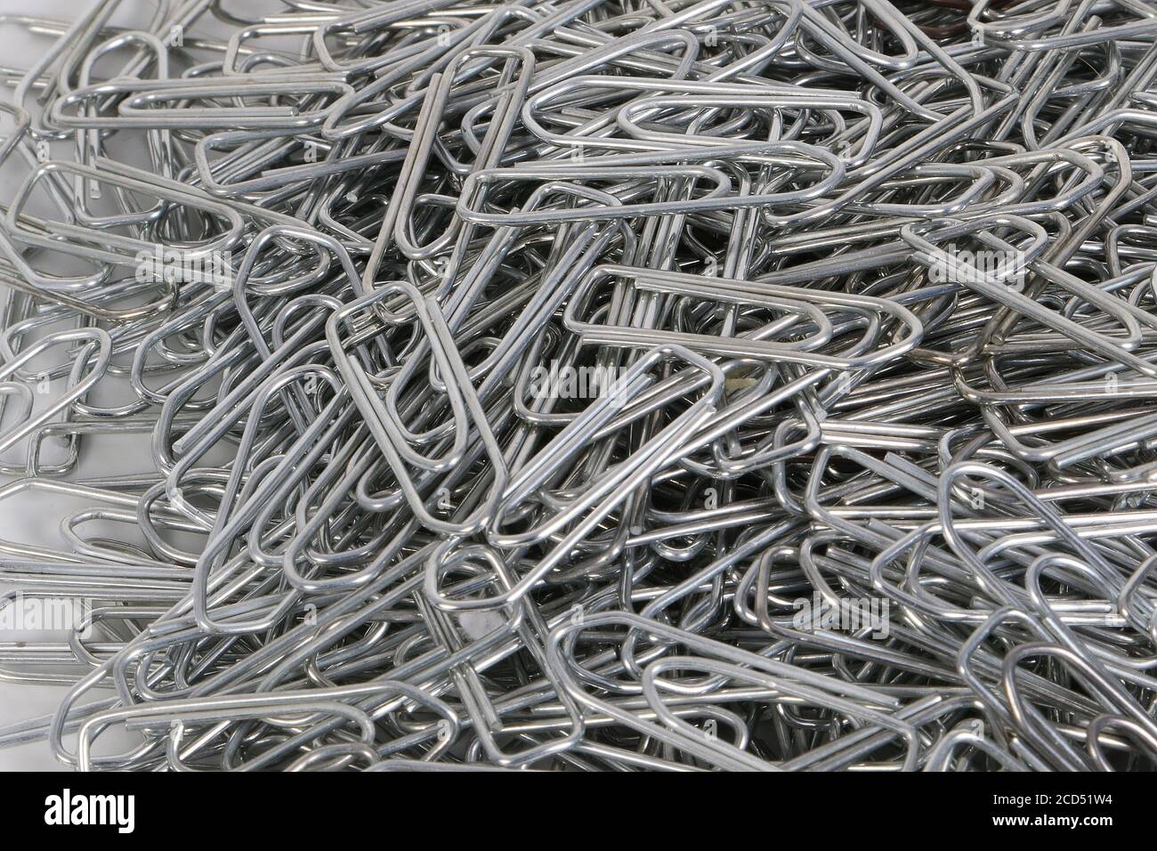 Closeup shot of a pile of paper clips on white background Stock Photo ...