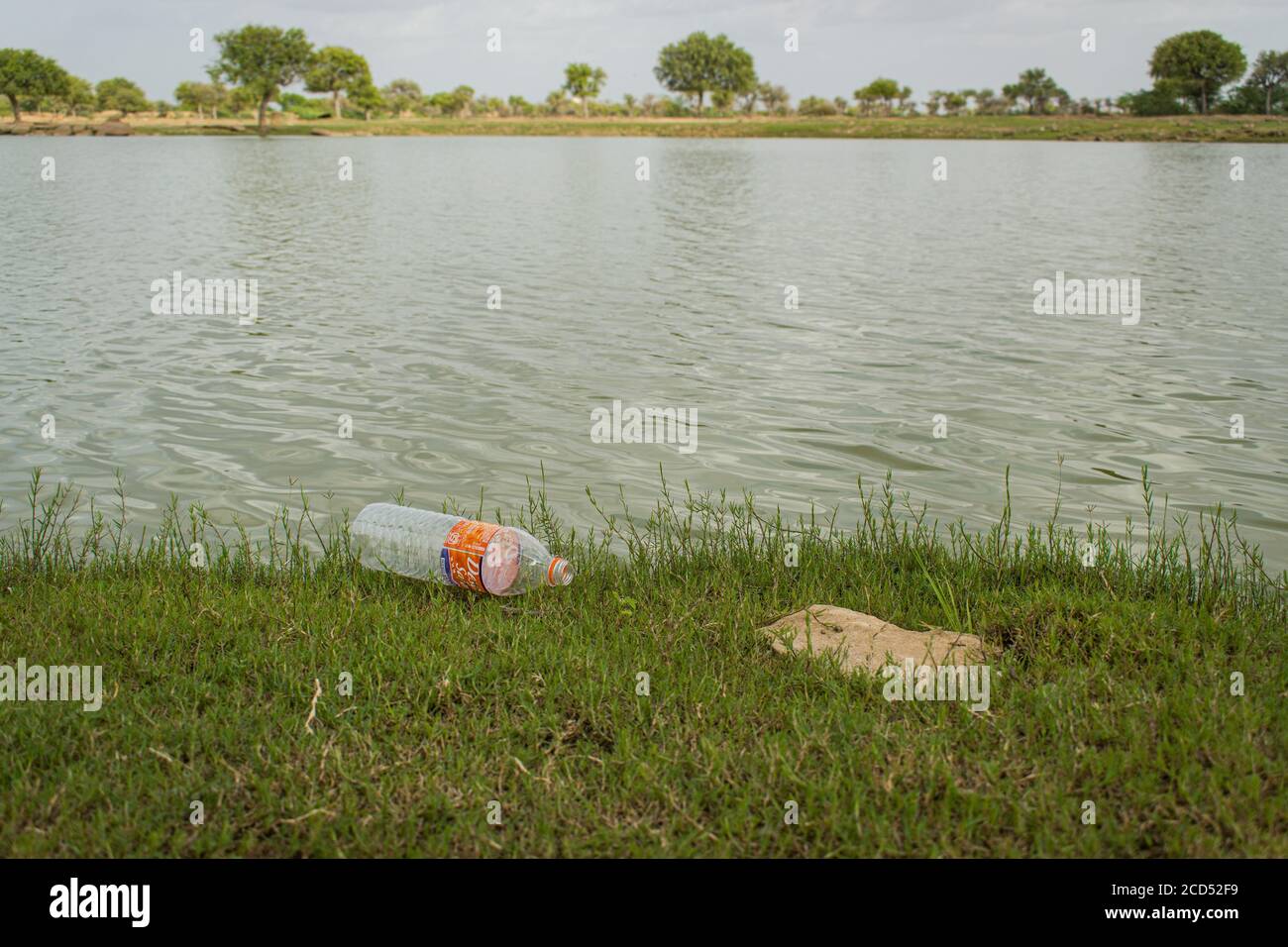 polluted lake plastic bottles and garbage at the lake. plastic ...