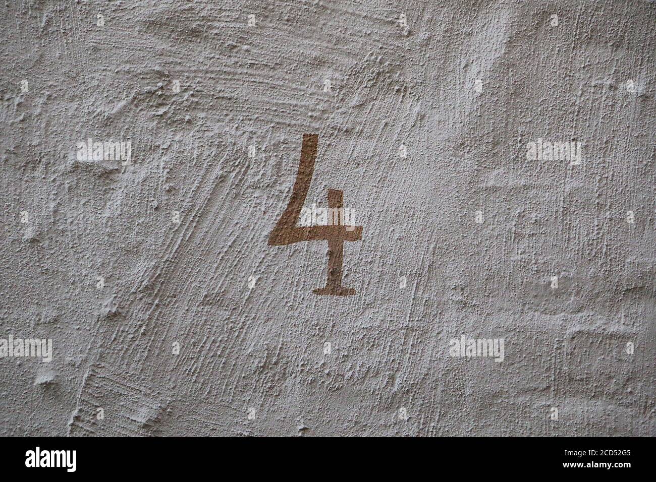Close up shot of number 4 on a white wall Stock Photo - Alamy