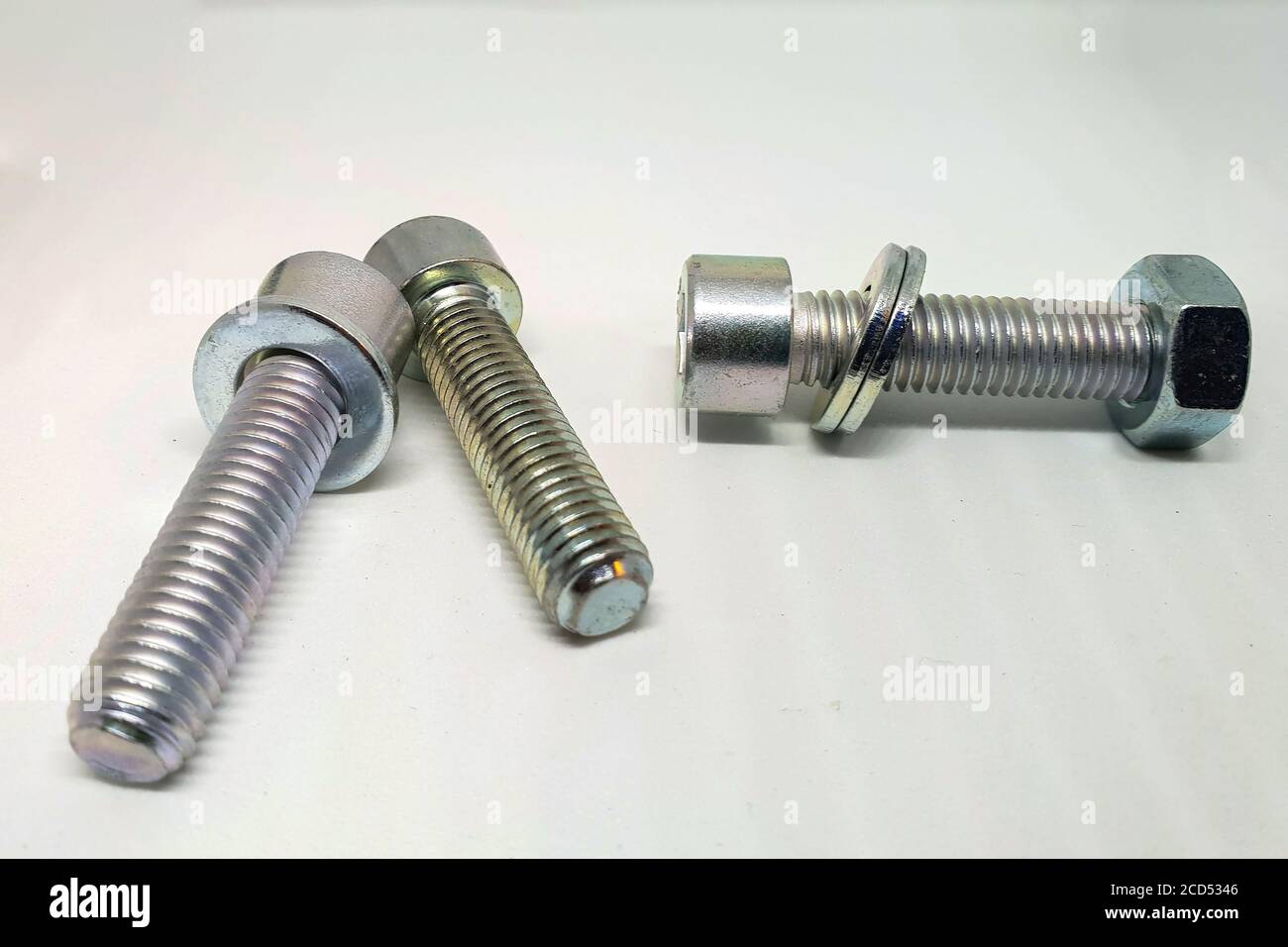 Closeup shot of a group of bolt and nut on white background Stock Photo ...