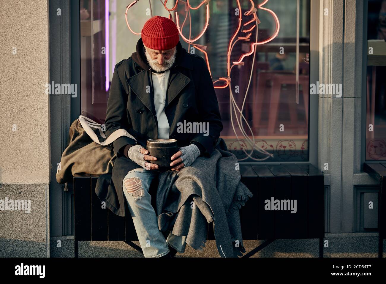 Mature caucasian vagrant man ask for some money donations from citizens ...