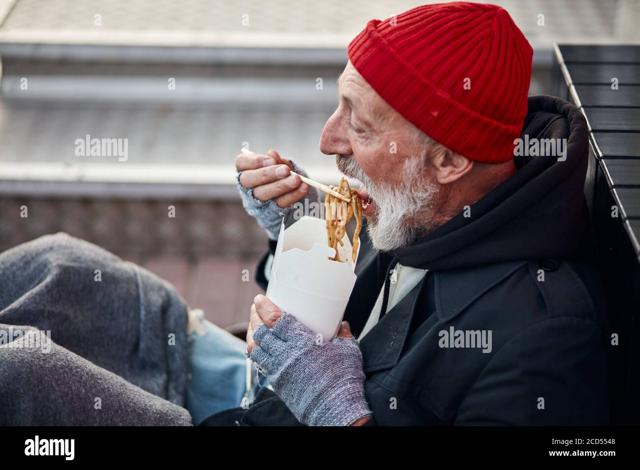 Side view aged man eating hi-res stock photography and images - Alamy
