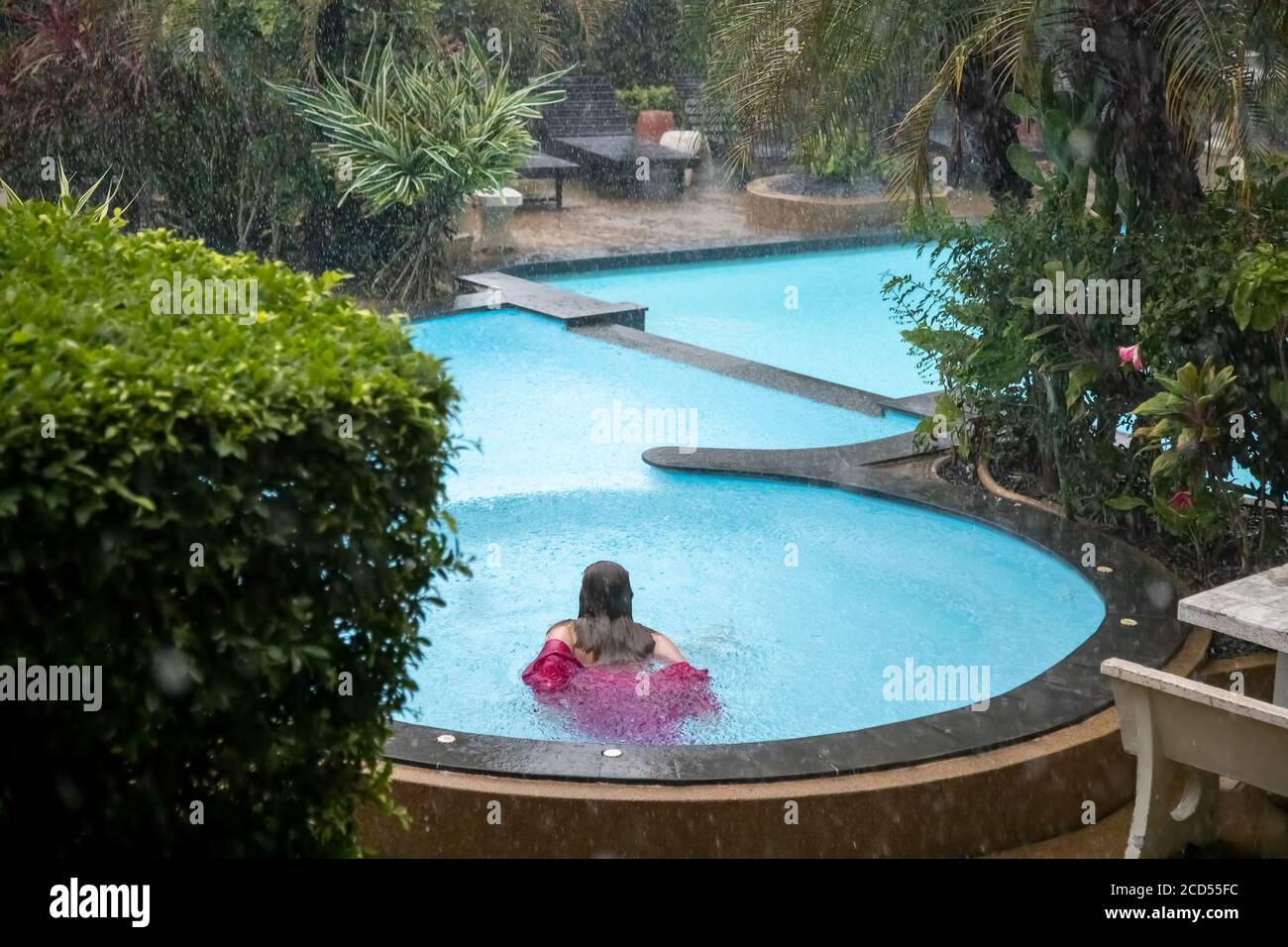 Bikini umbrella rain hi-res stock photography and images - Alamy