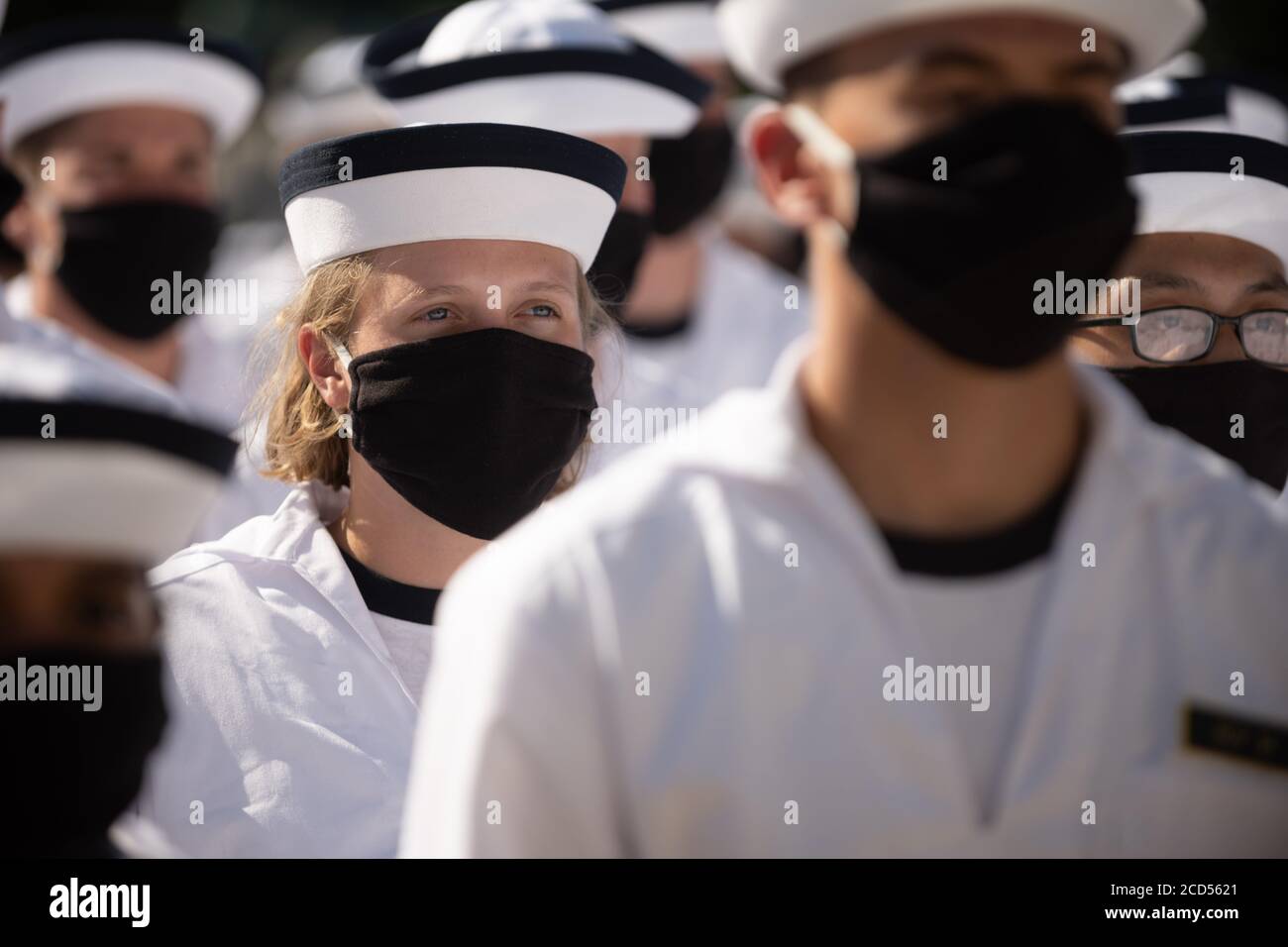 U.S. Naval Academy Navy midshipmen, wear PPE masks during the Oath of ...
