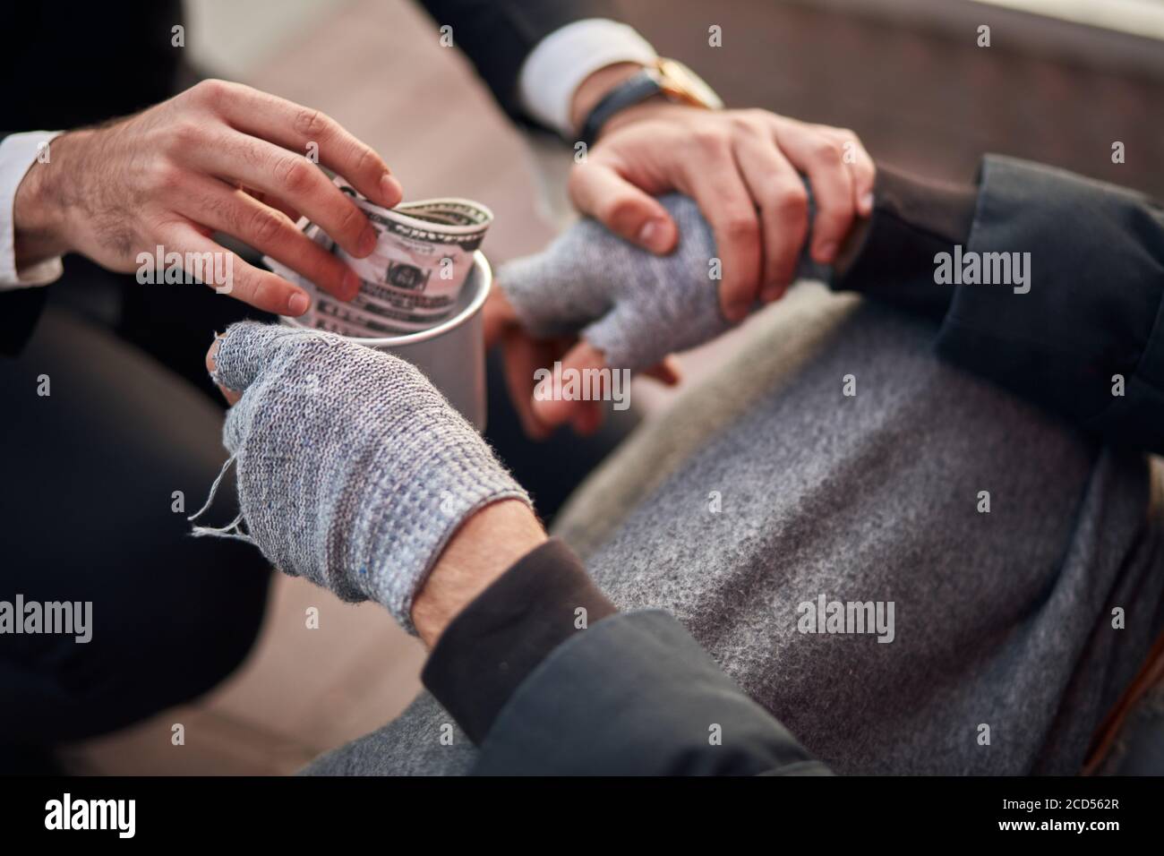 Give money cup street hi-res stock photography and images - Alamy