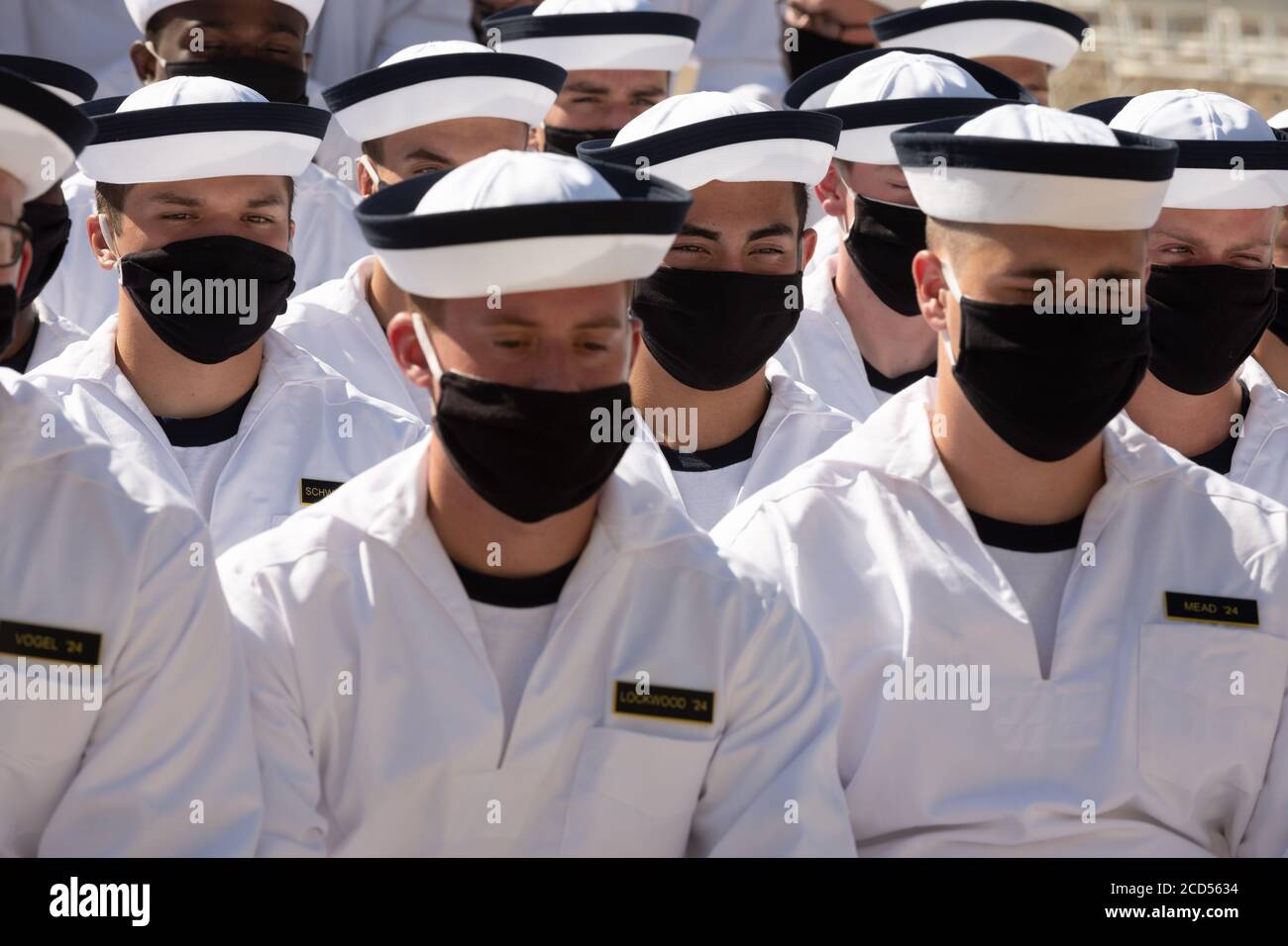 U.S. Naval Academy Navy midshipmen, wear PPE masks during the Oath of ...