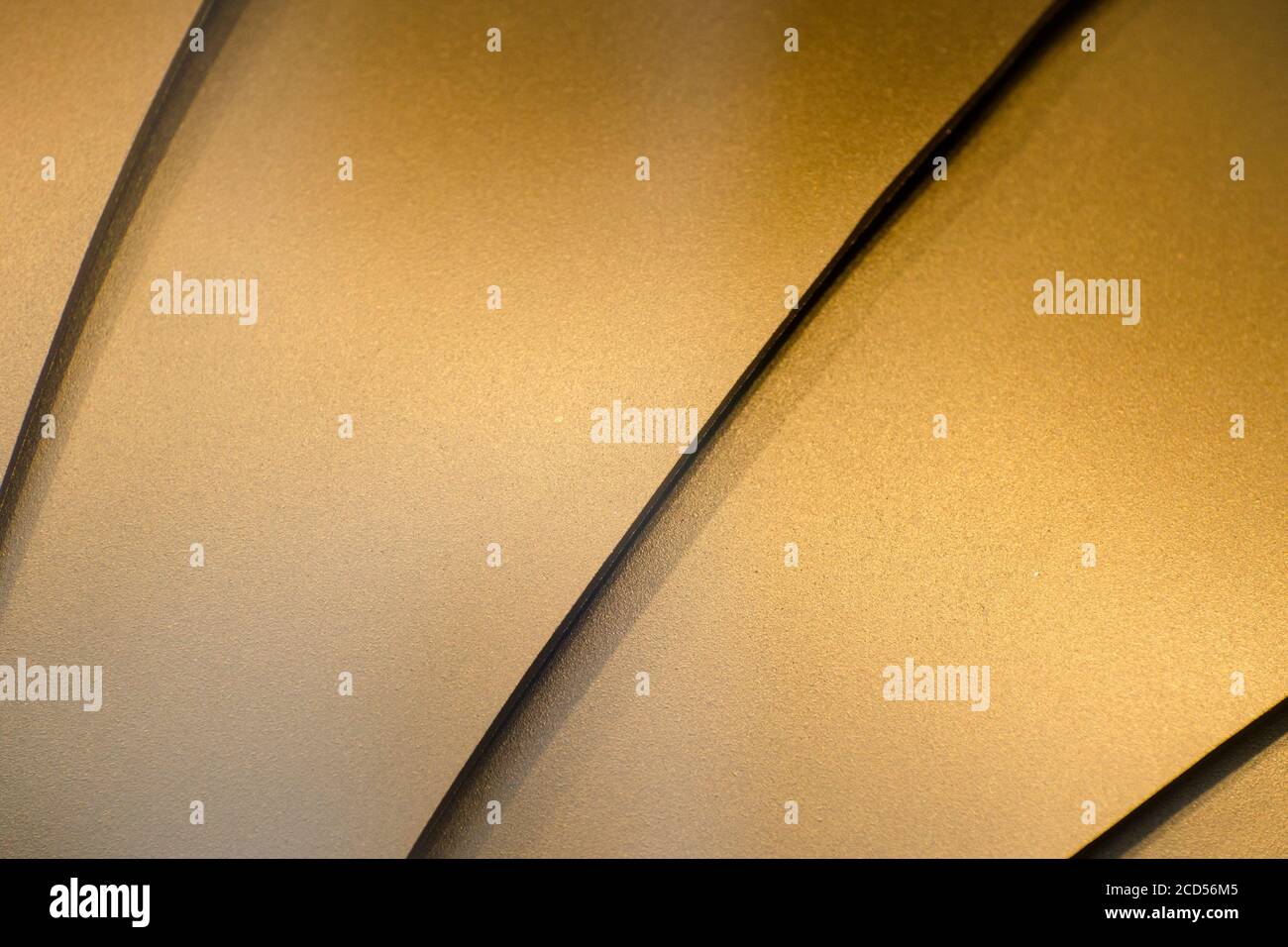 Wall painted with bronze paint. Gradient texture Stock Photo - Alamy