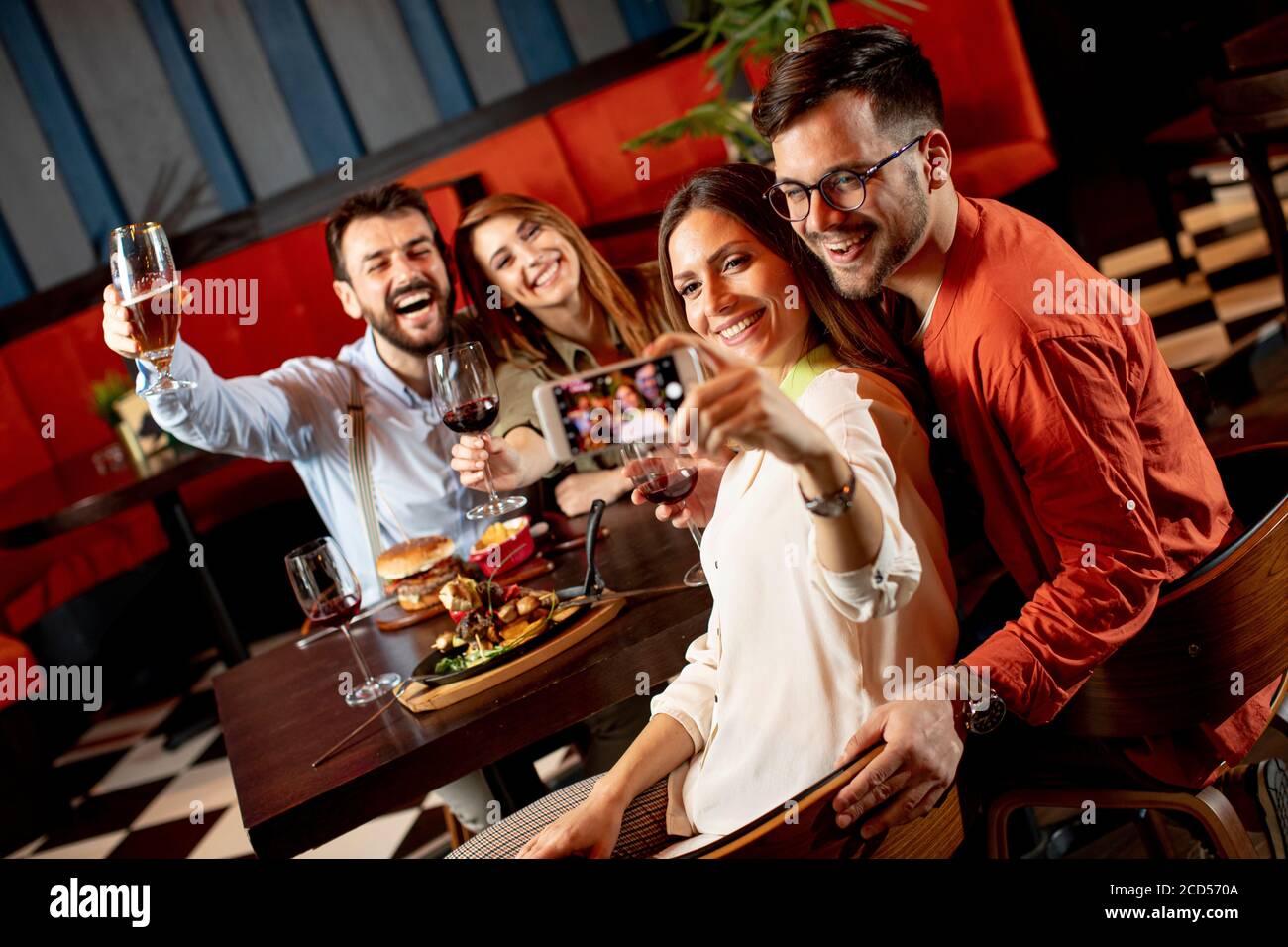 Group of women taking a selfie in a bar hi-res stock photography and ...