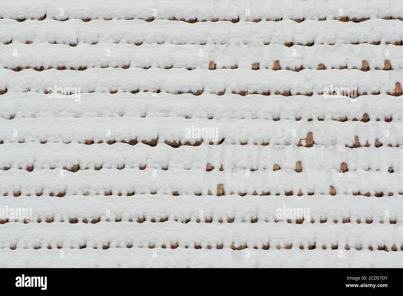 The roof of clay tiles covered with snow. Texture Stock Photo - Alamy