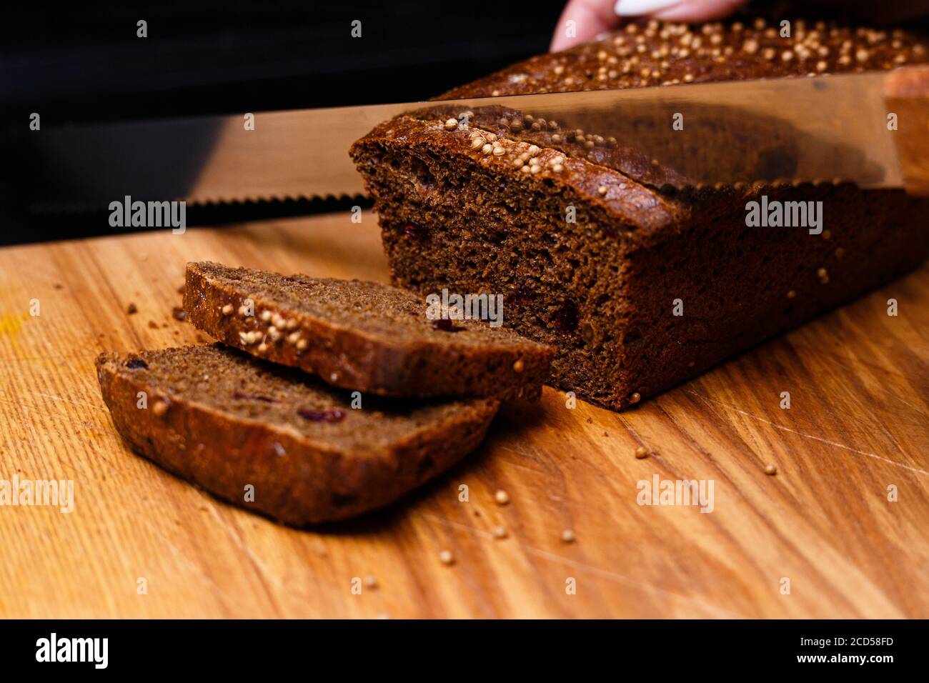 Homemade black bread on a black background. Photo in section Stock ...