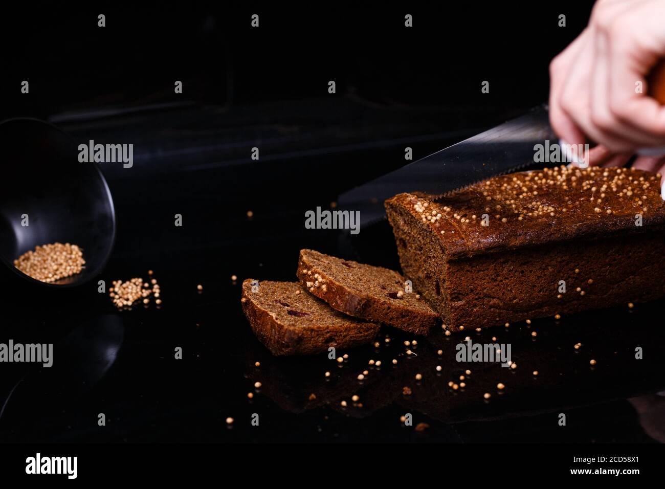 Homemade black bread on a black background. Photo in section Stock ...