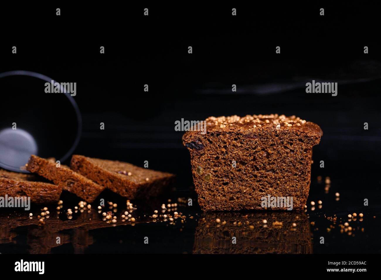Homemade black bread on a black background. Photo in section Stock ...