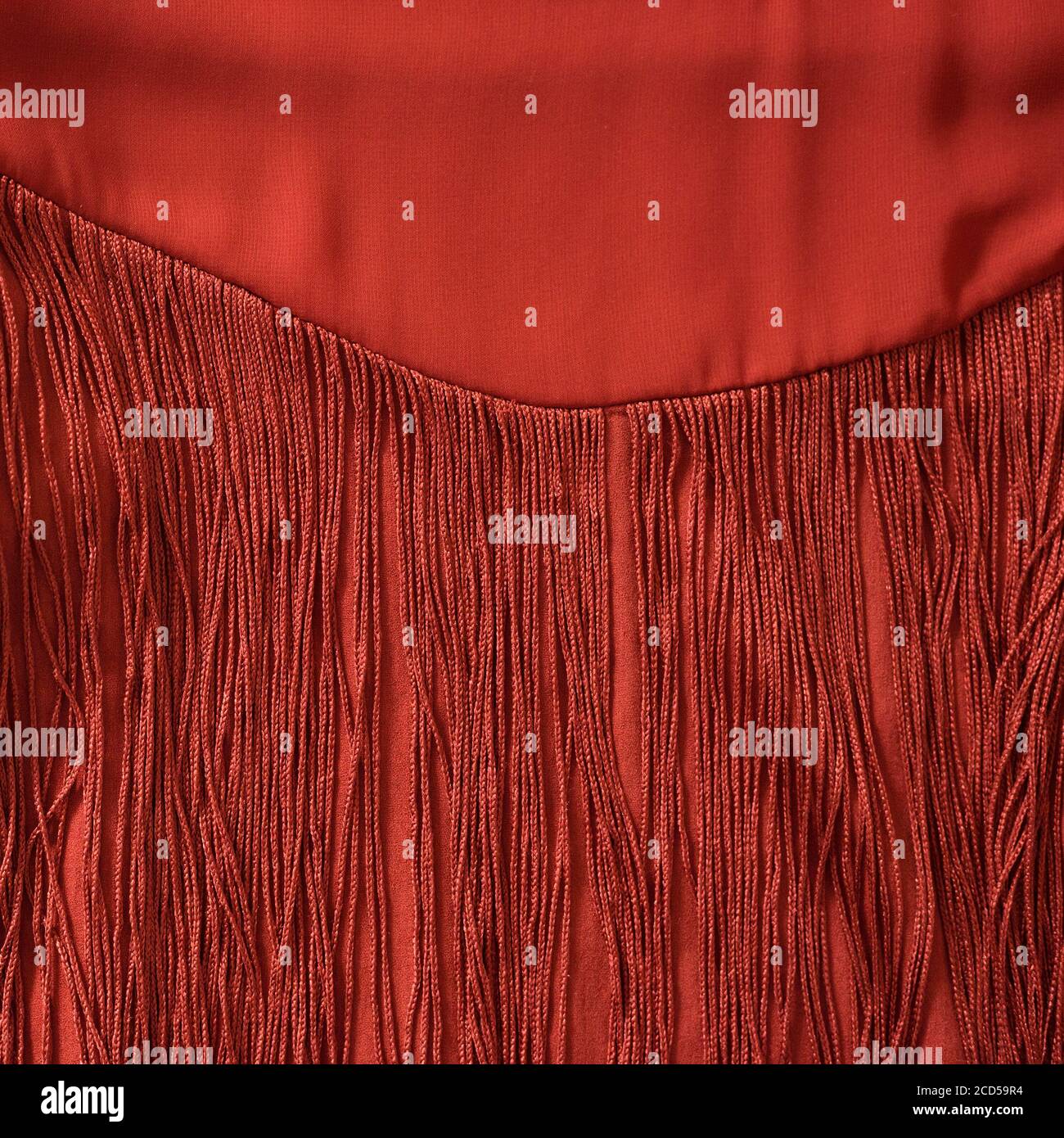 Details of maroon clothing with fringe. Close-up. Background Stock ...