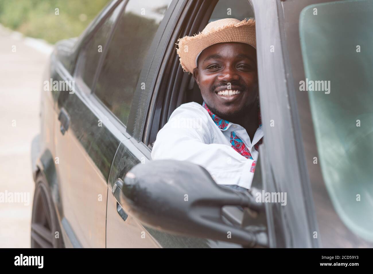 Smiling african american man driving hi-res stock photography and ...