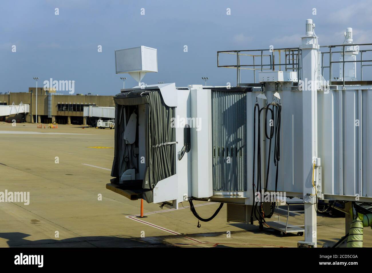 Waiting in airport in airplane for bridge passengers boarding jetway ...