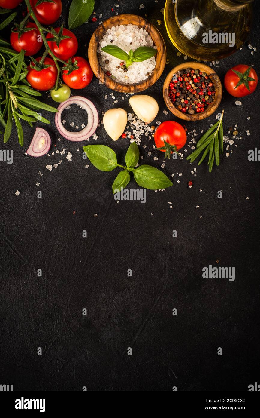 Food cooking background at black top view Stock Photo - Alamy