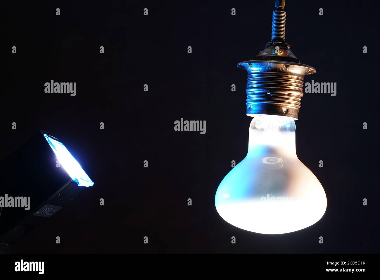 Closeup shot of electric light bulb in the dark room Stock Photo - Alamy
