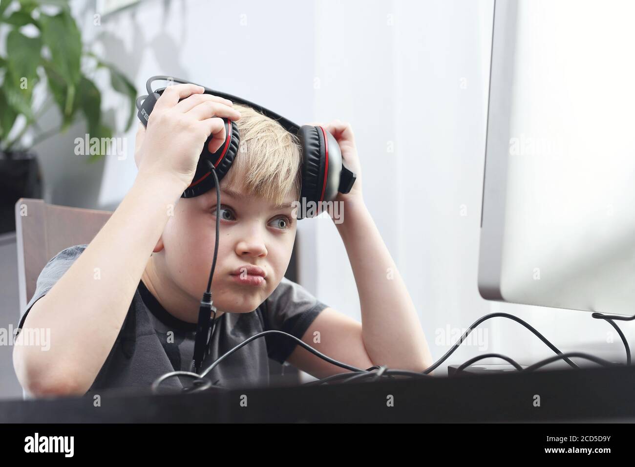 Online lesson.E-learning. School on the web. The child learns via the ...