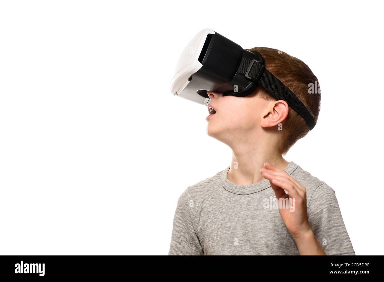 Boy experiencing virtual reality. Portrait. Isolate on white background ...