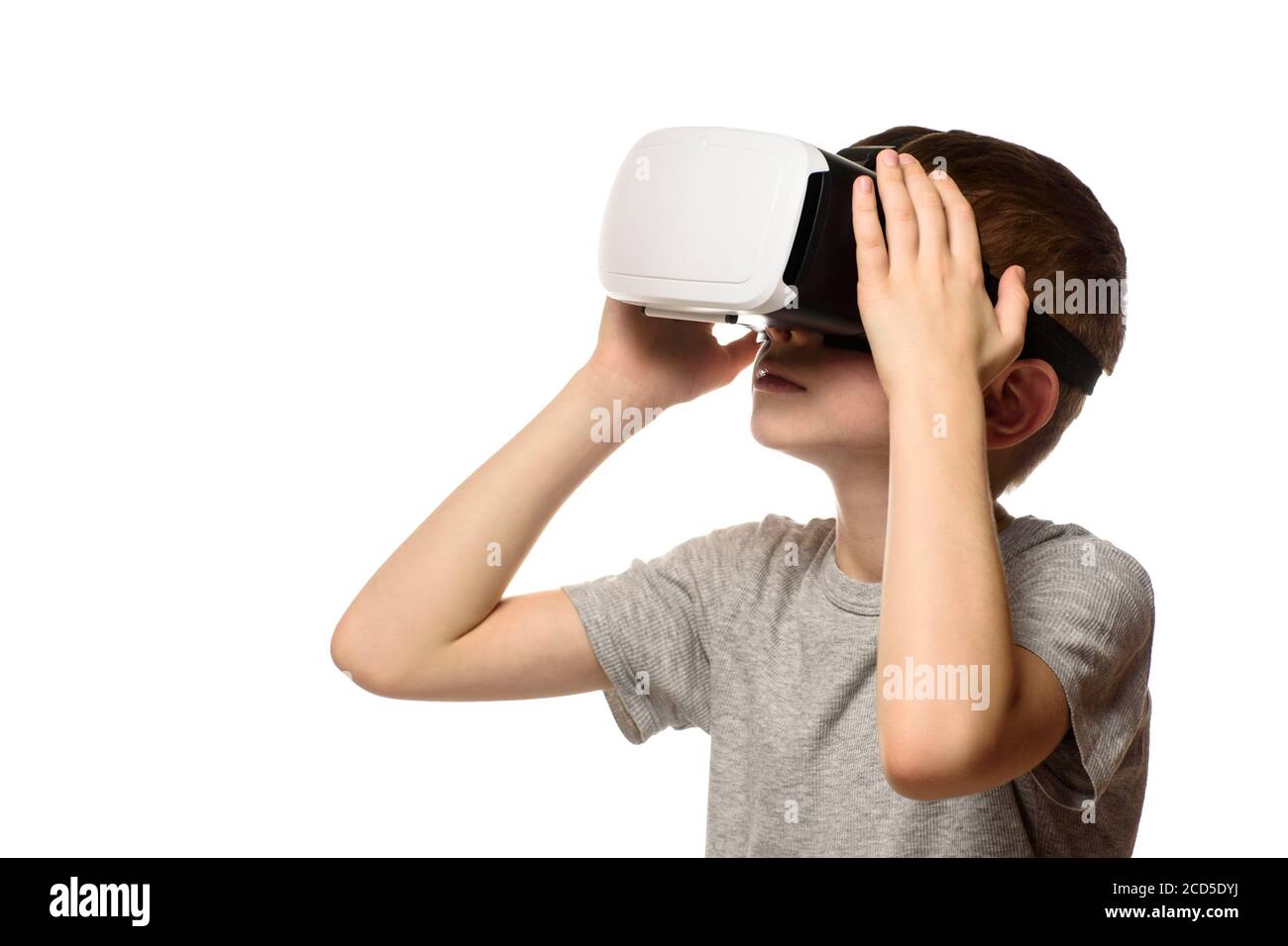 Boy experiencing virtual reality. Portrait. Isolate on white background ...