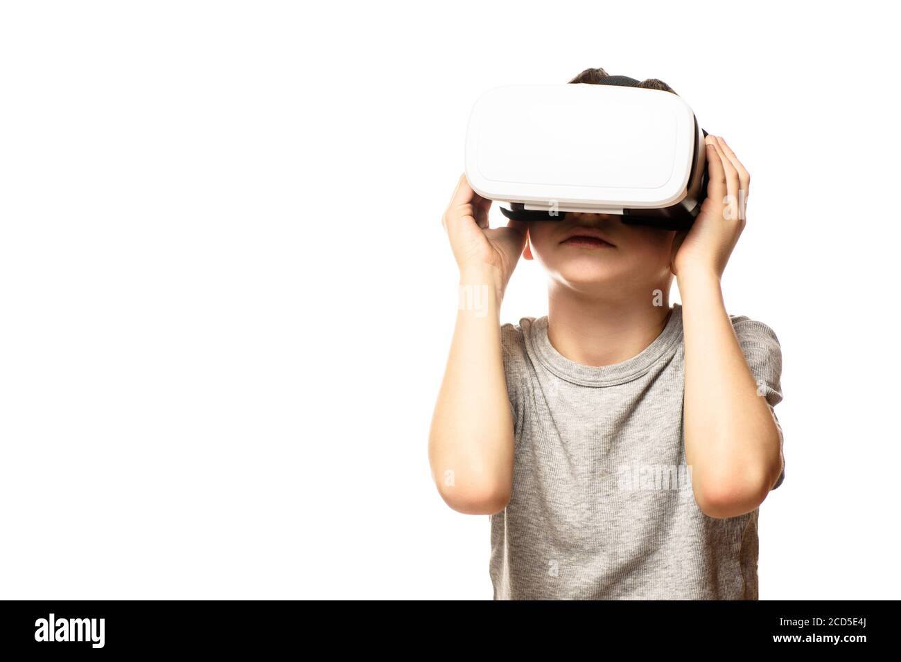 Boy experiencing virtual reality. Portrait. Isolate on white background ...