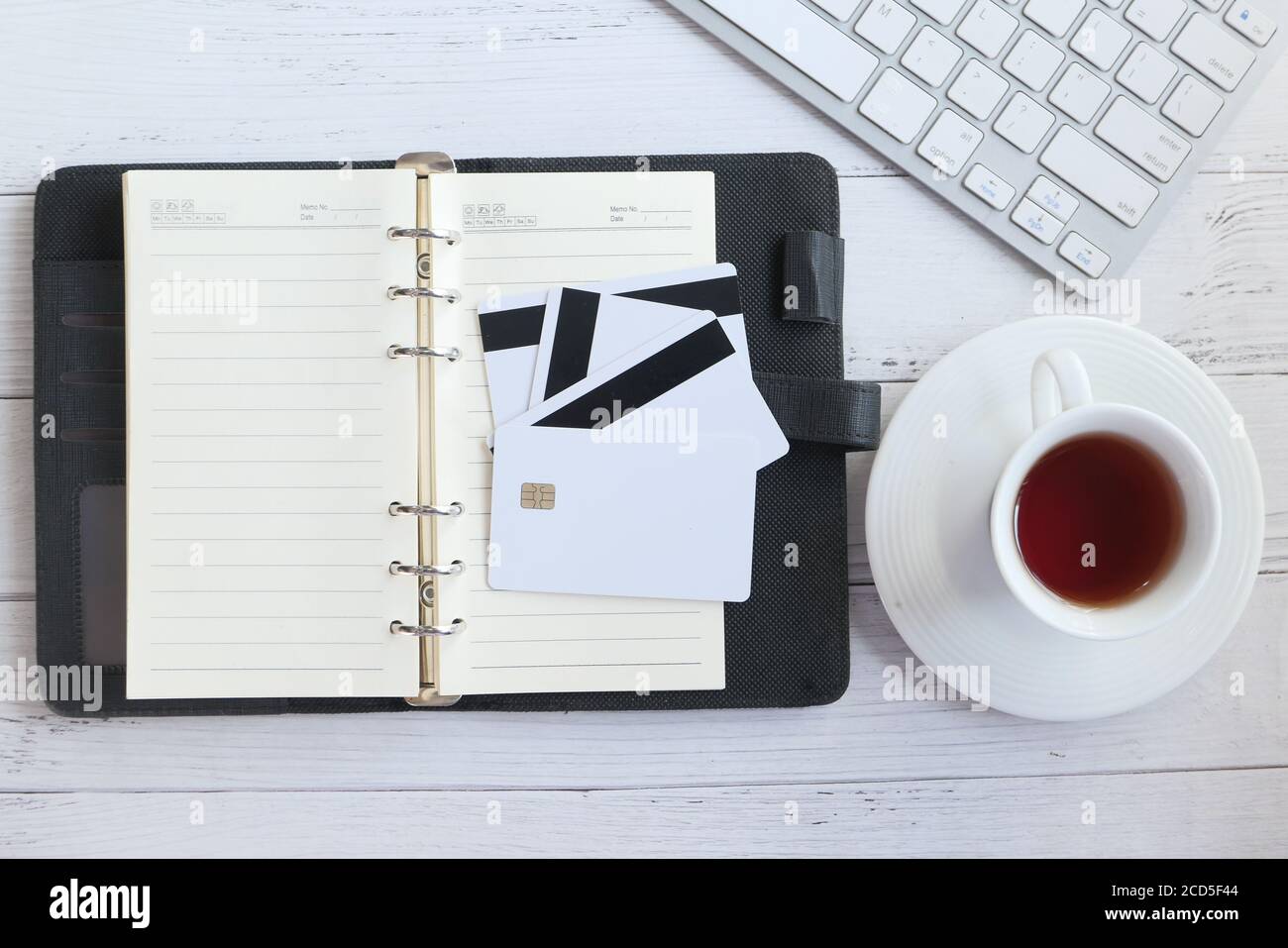 high angle view of credit card on notepad on desk Stock Photo - Alamy