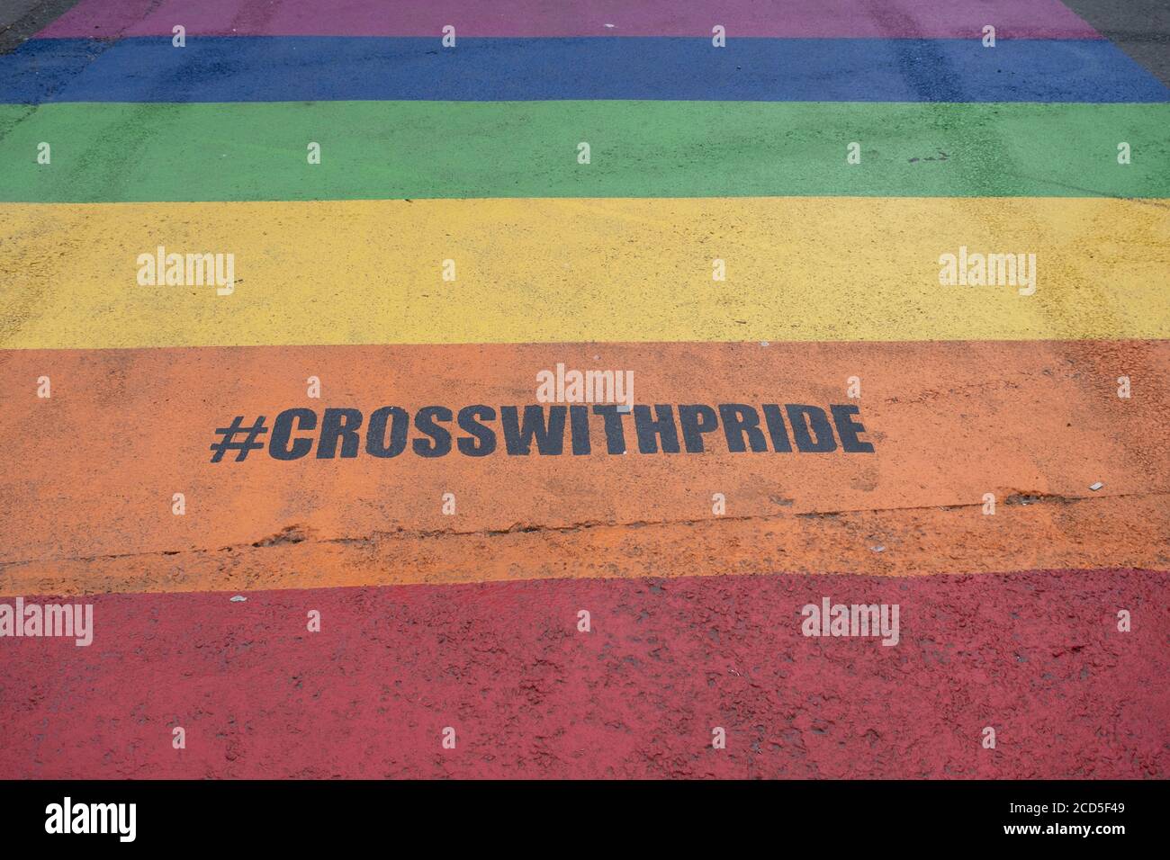 Pedestrians walk across a rainbow colored crossing on 24th August 2020 ...