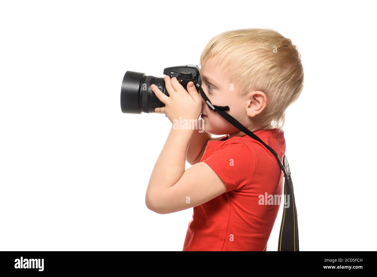 Young blond boy in red shirt with camera. Portrait, isolated on white ...