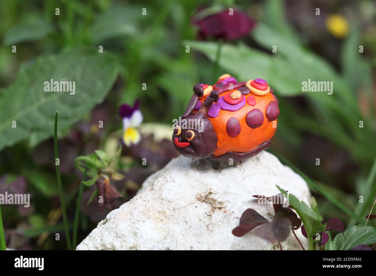 Plasticine world - little hand-made funny bug Stock Photo - Alamy