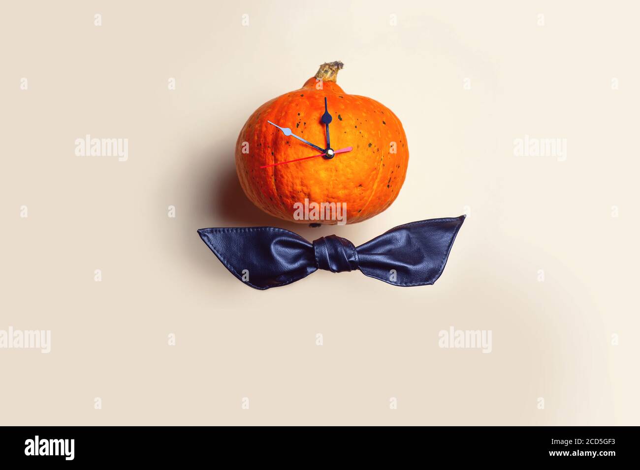 Pumpkin clock shows the time before Halloween. Concept Stock Photo - Alamy