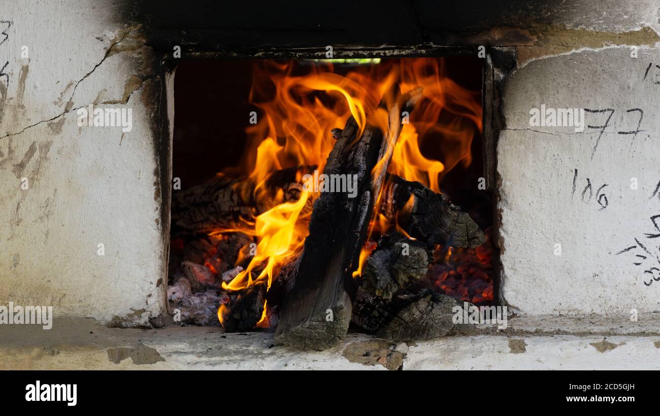 Countryside wood burning cook stove.Outdoor stone oven fireplace ...