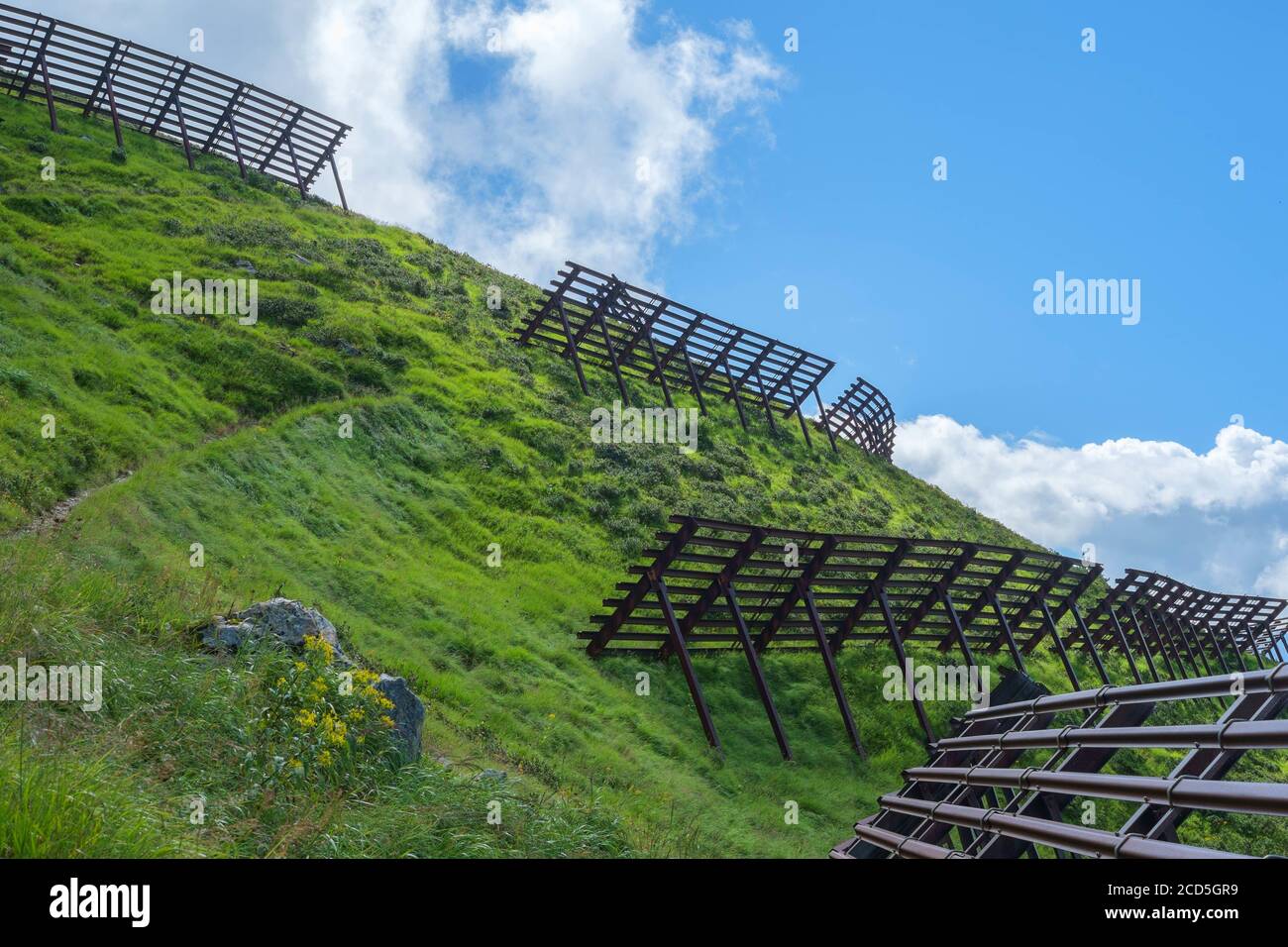 Shot of avalanche fences on a mountain Stock Photo - Alamy