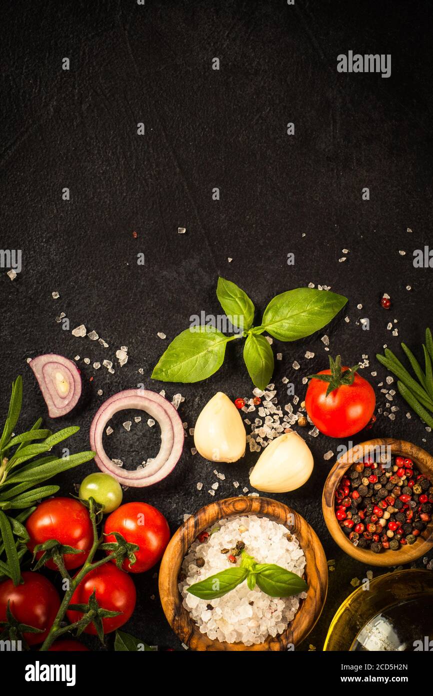 Food cooking background at black top view Stock Photo - Alamy