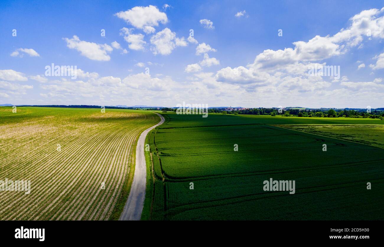 Aerial view of road through green rural landscape Stock Photo - Alamy